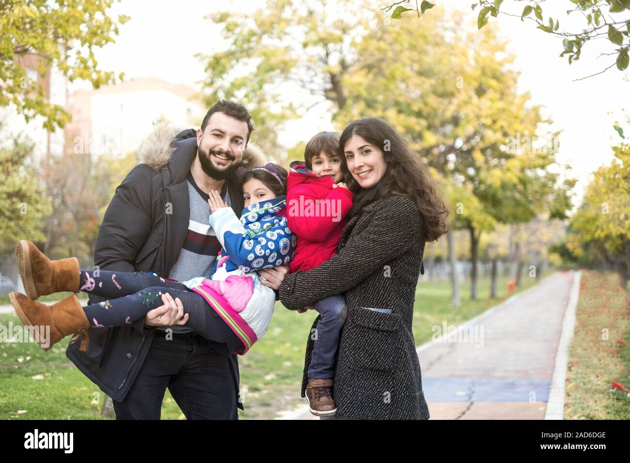 Portrait four happy family members hi-res stock photography and images ...