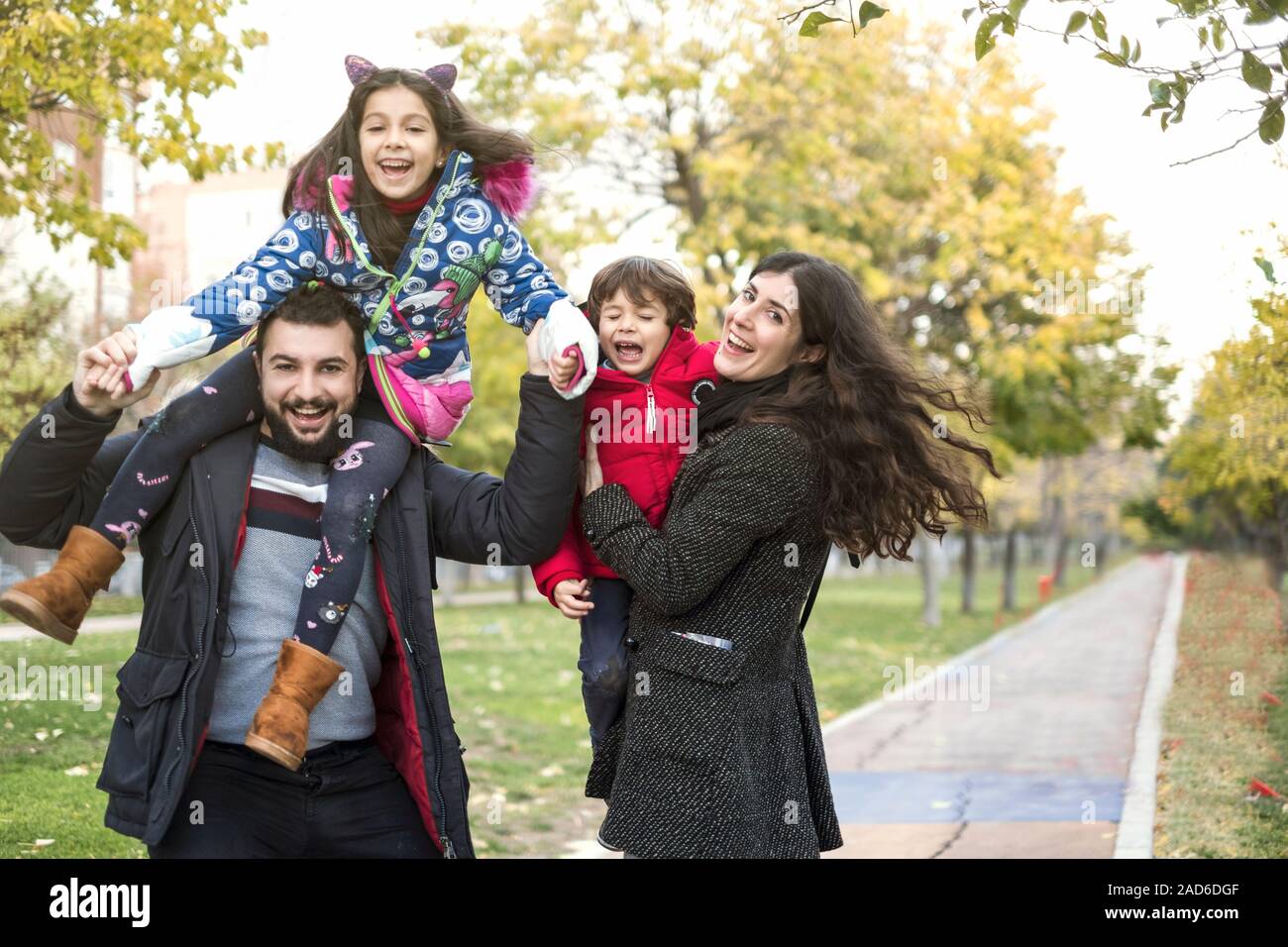 Portrait four happy family members hi-res stock photography and images ...