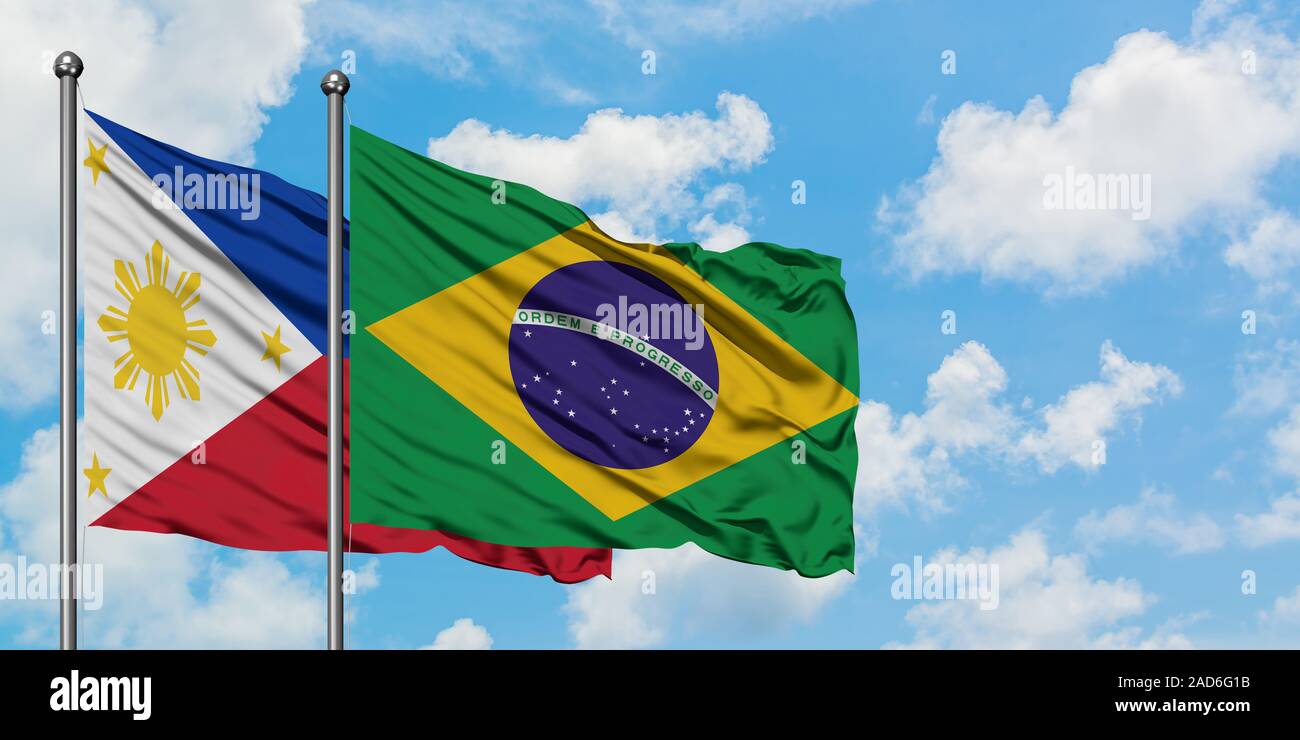 Philippines and Brazil flag waving in the wind against white cloudy ...
