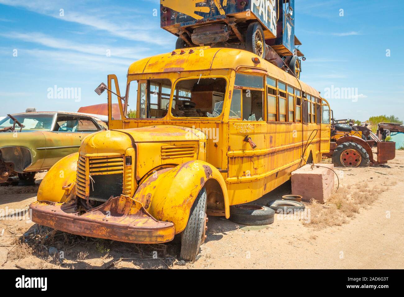 rusty old cars and trucks in a junk yard in the desert in Phoenix ...