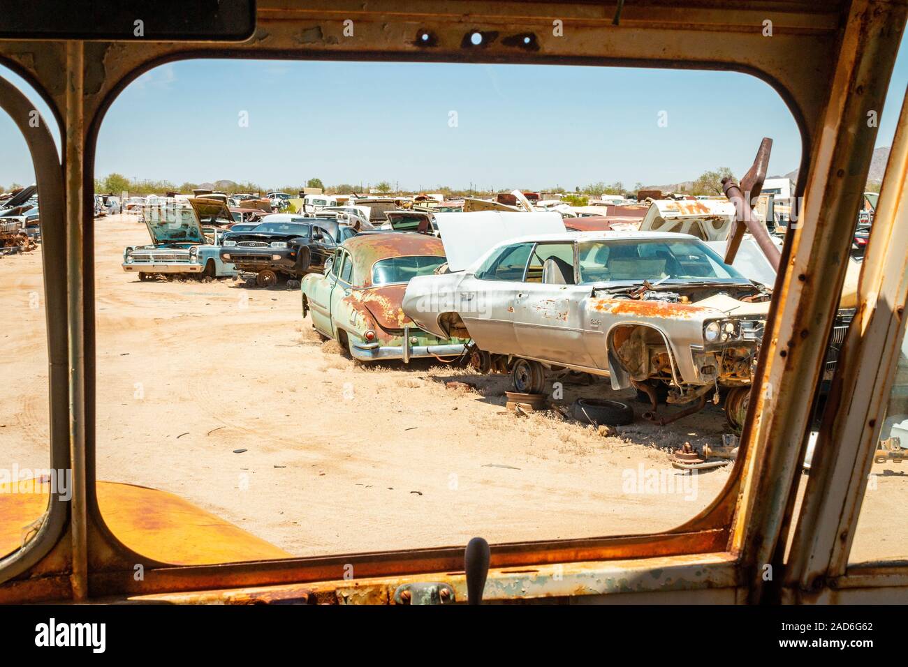 view through wrecked car window in a junk yard in the desert in Phoenix ...