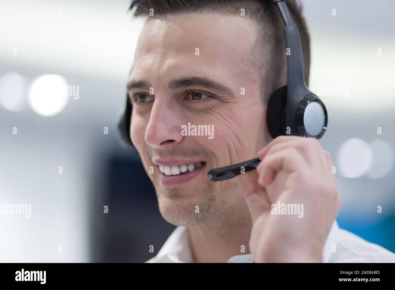 male call centre operator doing his job Stock Photo - Alamy
