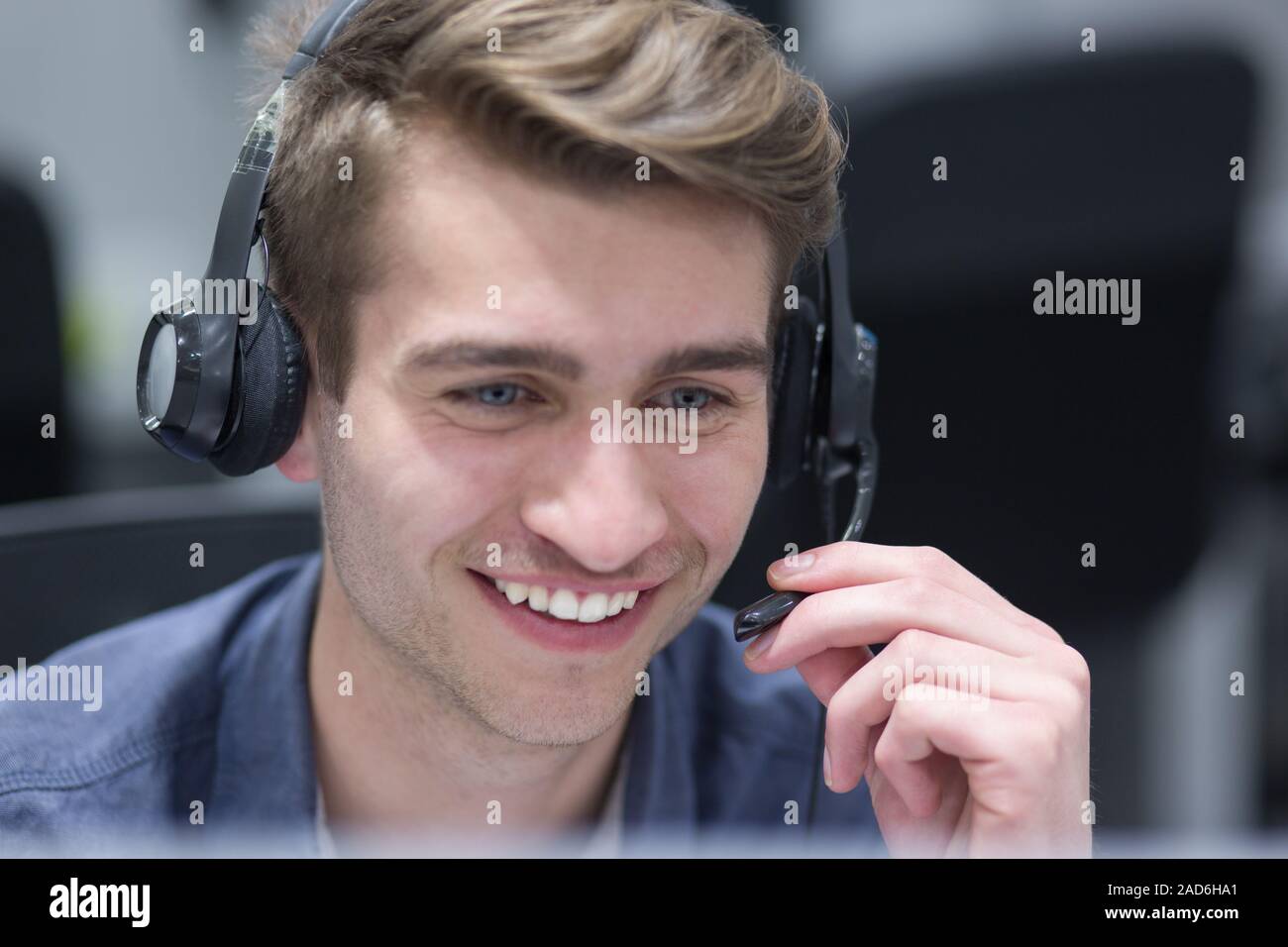 male call centre operator doing his job Stock Photo - Alamy