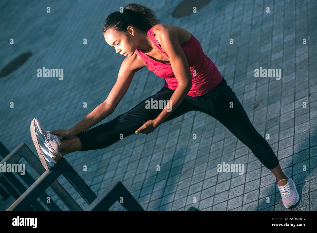 Carefully stretching muscles of the leg stock photo Stock Photo - Alamy
