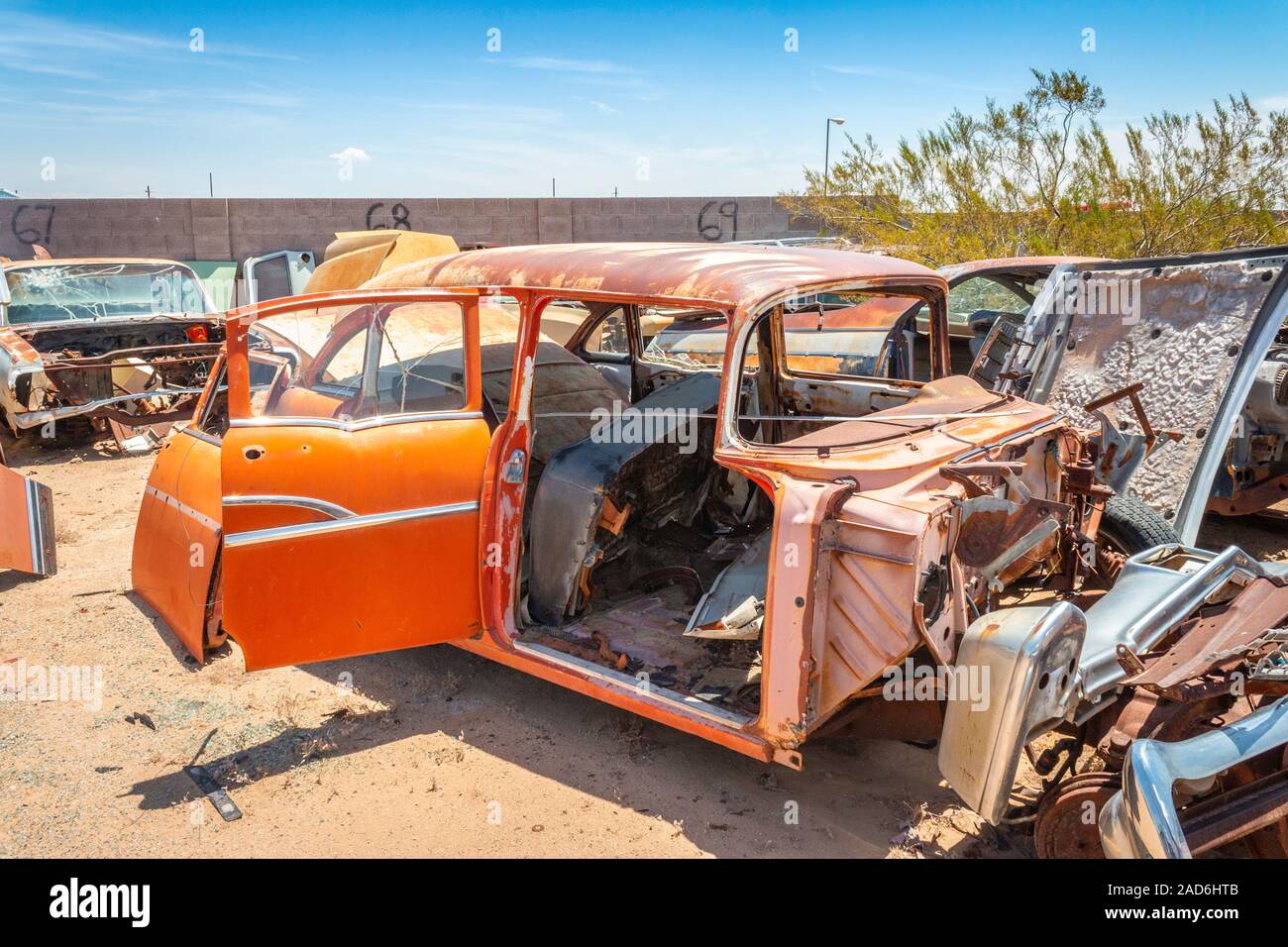 rusty old cars and trucks in a junk yard in the desert in Phoenix ...