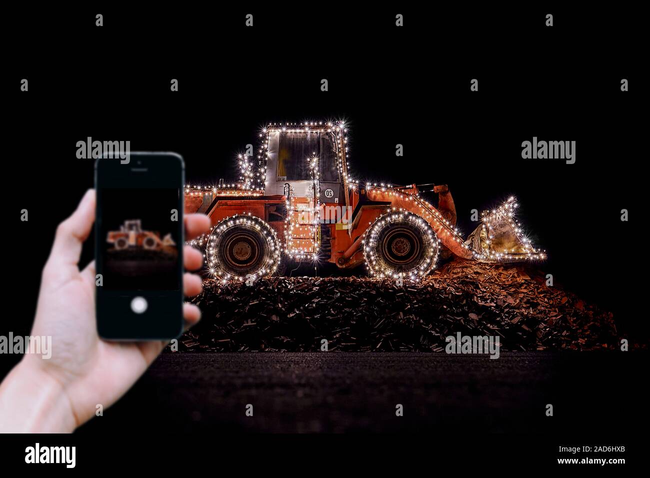 Mobile picture of a Blurred wheel loader decorated with lights at ...