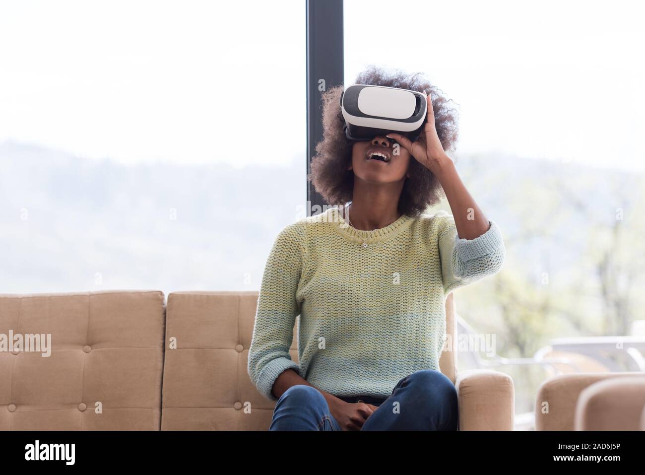 black woman using VR headset glasses of virtual reality Stock Photo - Alamy