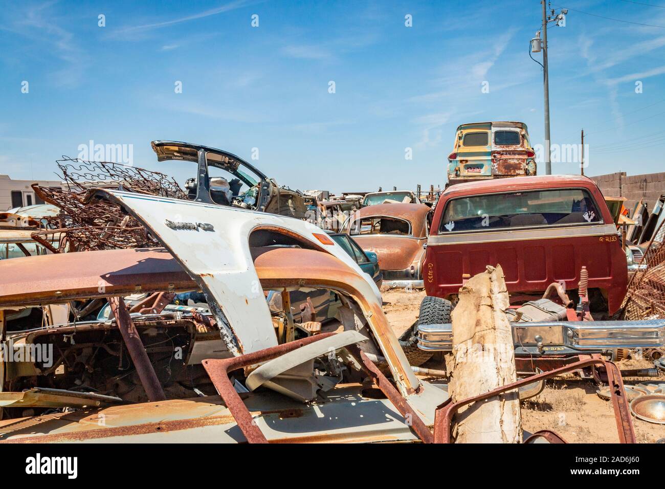 rusty old cars and trucks in a junk yard in the desert in Phoenix ...