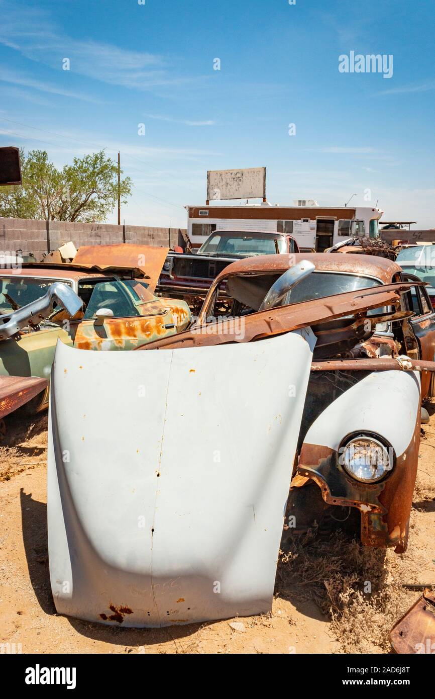 rusty old cars and trucks in a junk yard in the desert in Phoenix ...