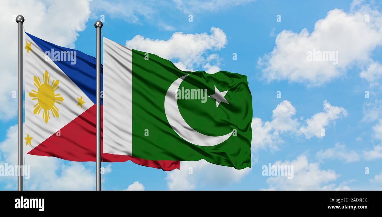 Philippines and Pakistan flag waving in the wind against white cloudy ...