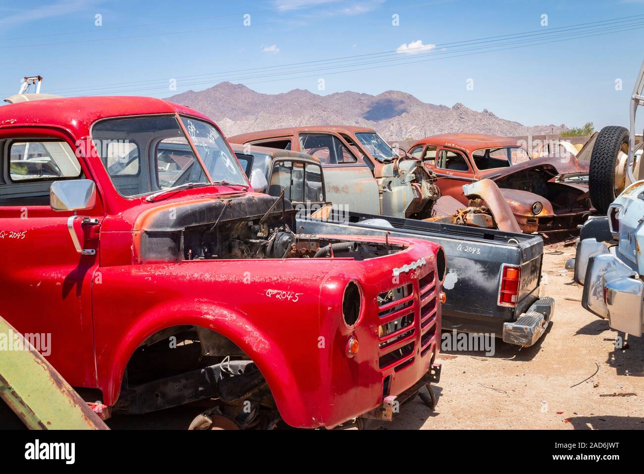 rusty old Dodge truck in a junk yard in the desert in Phoenix Arizona ...