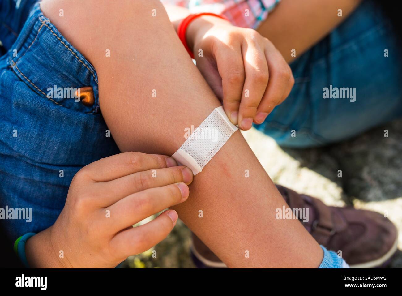 Child sticking plaster on leg Stock Photo - Alamy
