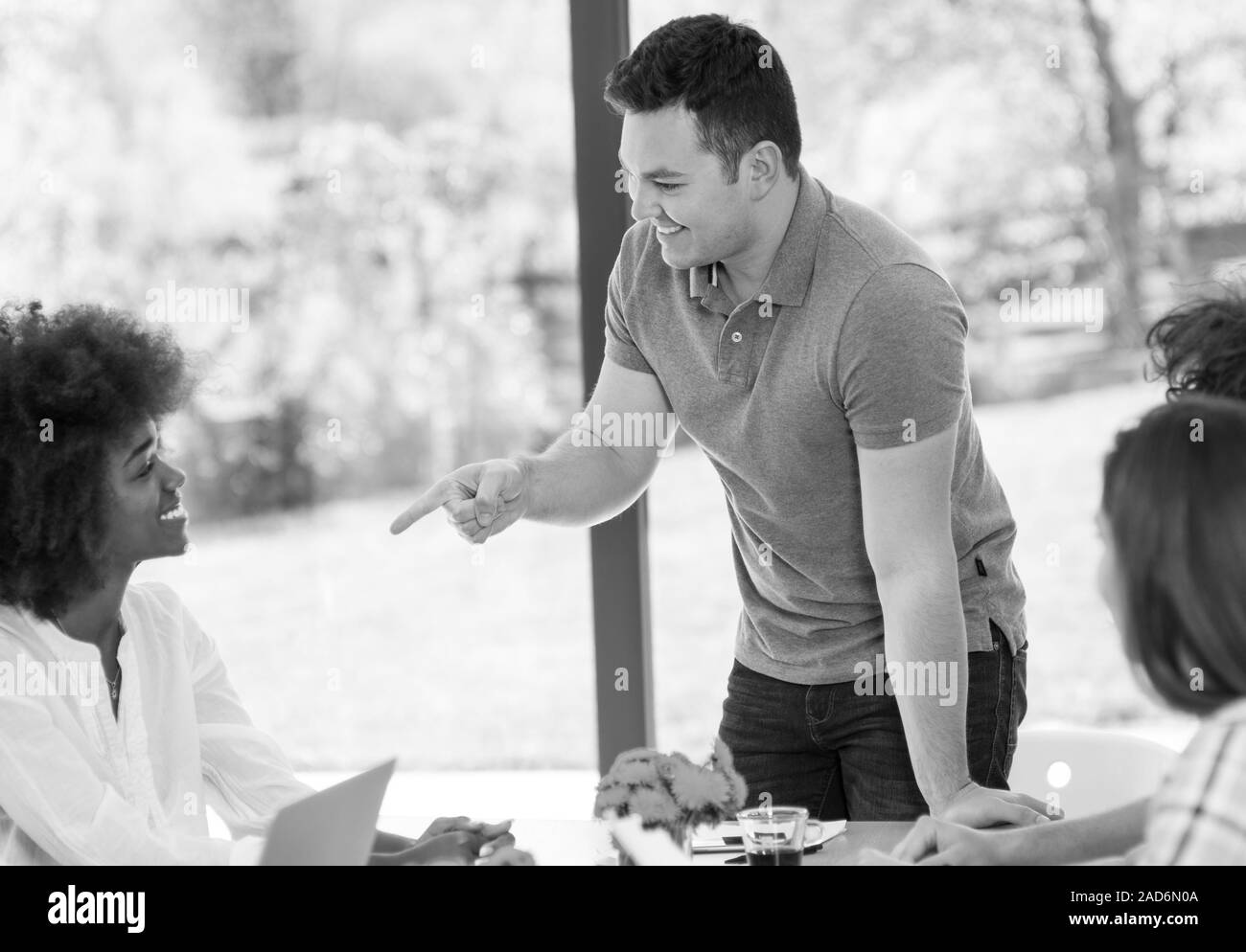 Young businessman working together Black and White Stock Photos ...