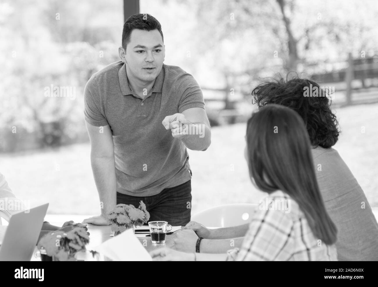 Young businessman working together Black and White Stock Photos ...