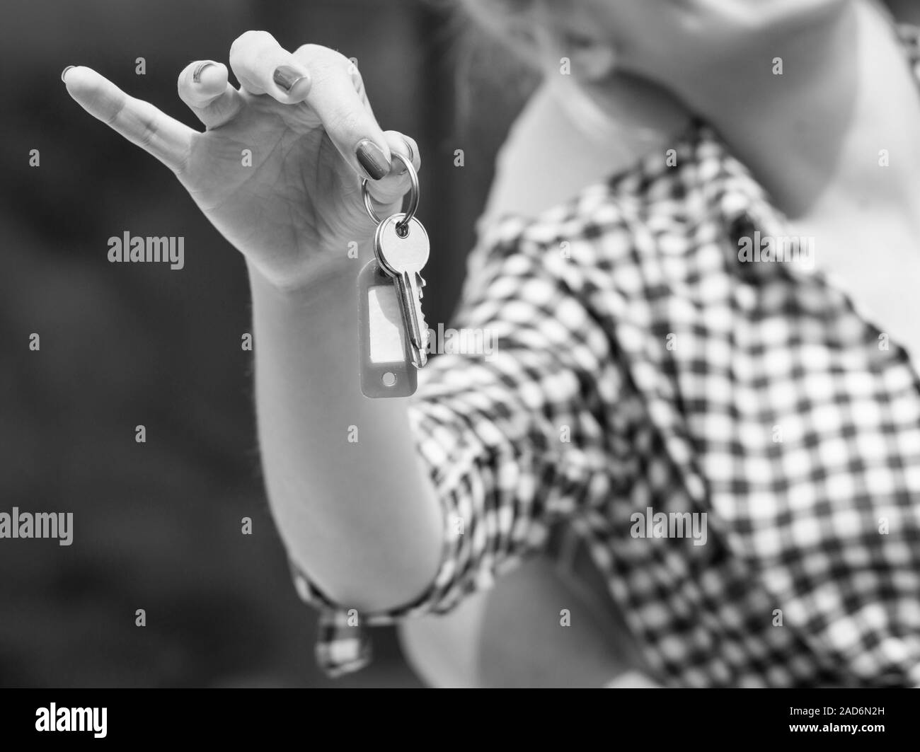 Woman house keys Black and White Stock Photos & Images - Alamy