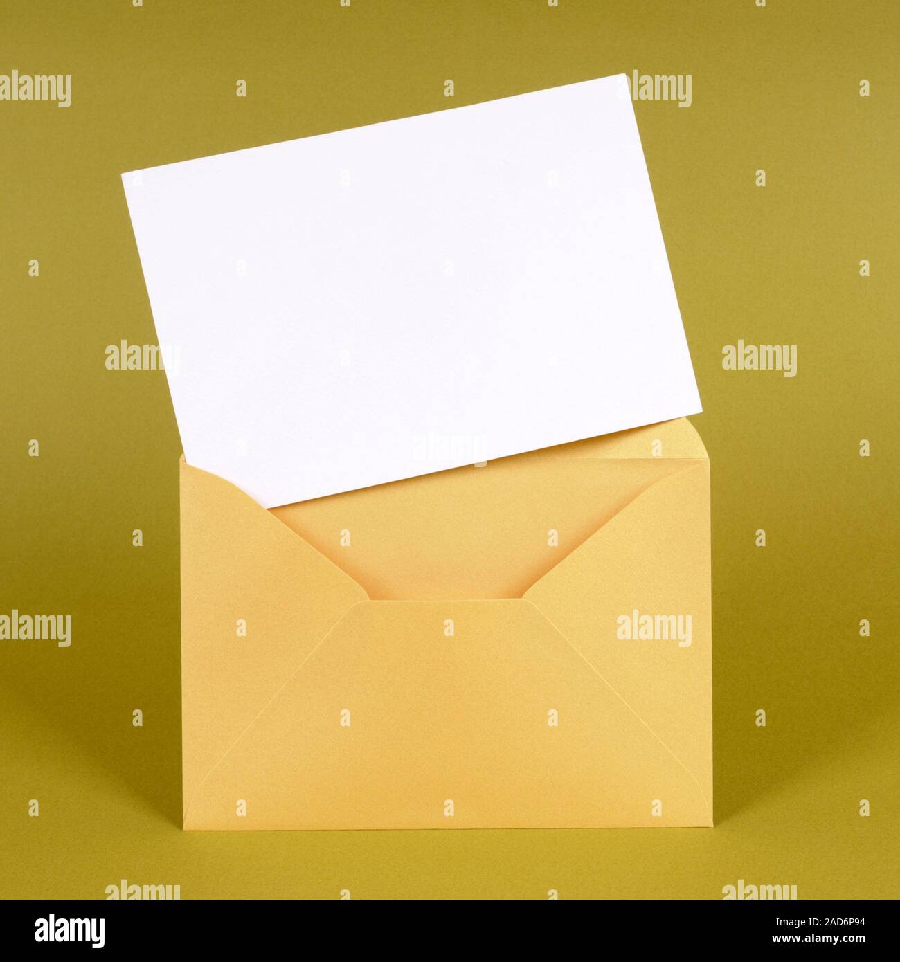 Metallic gold envelope with blank message card letter or invitation ...