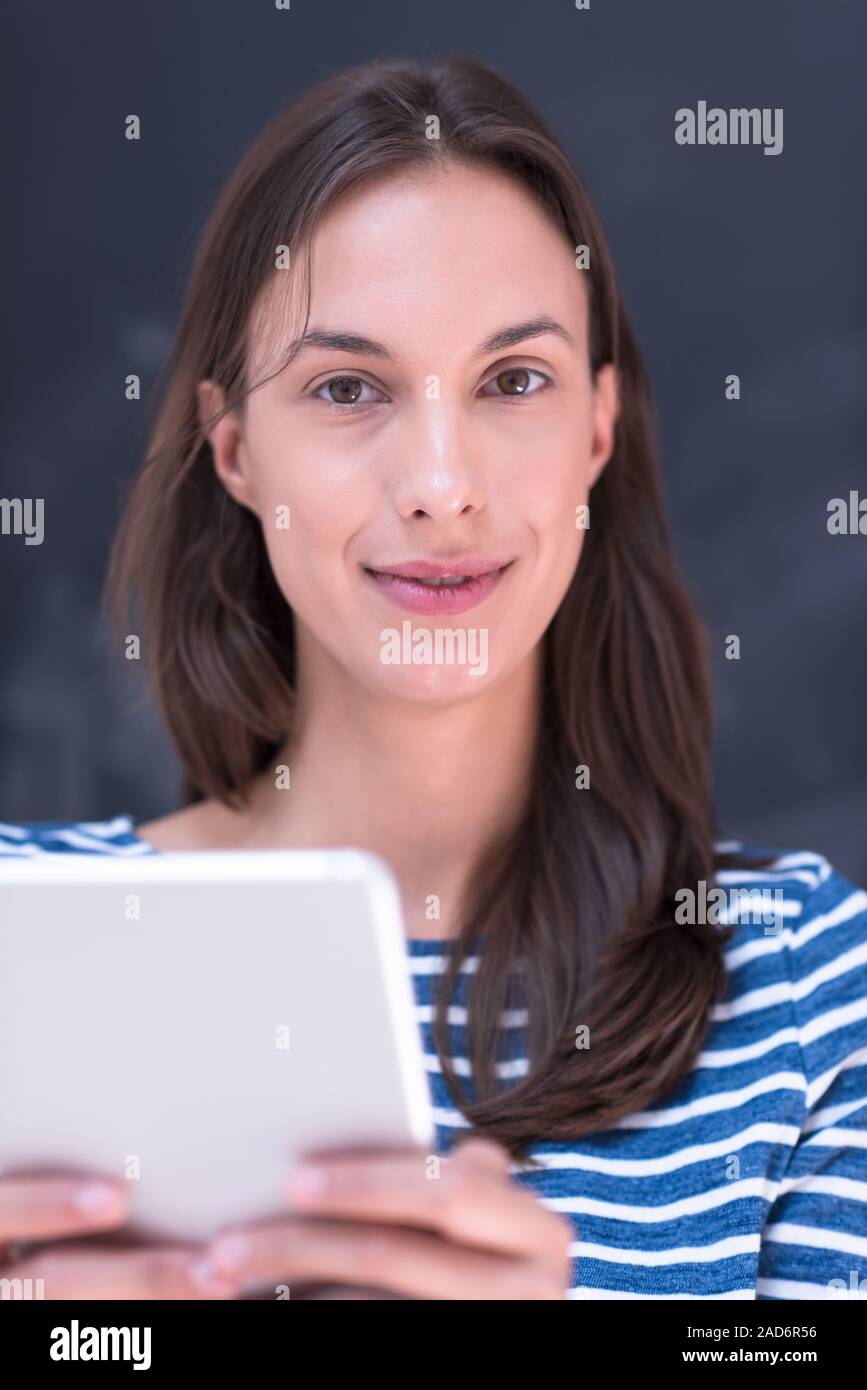 woman using tablet in front of chalk drawing board Stock Photo - Alamy