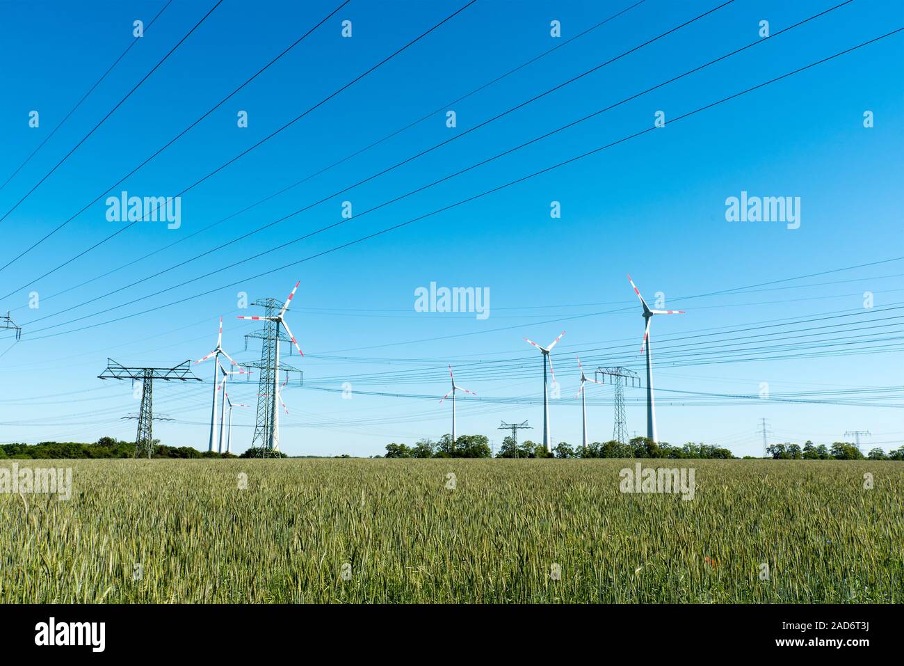 Wind power plants and power transmission lines seen in rural Germany ...
