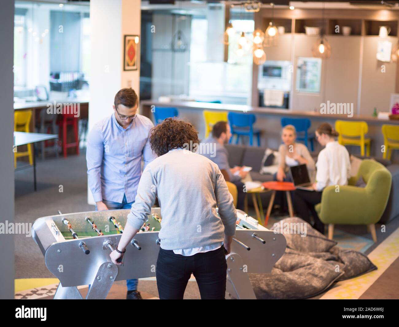 Office People Enjoying Table Soccer Game Stock Photo - Alamy
