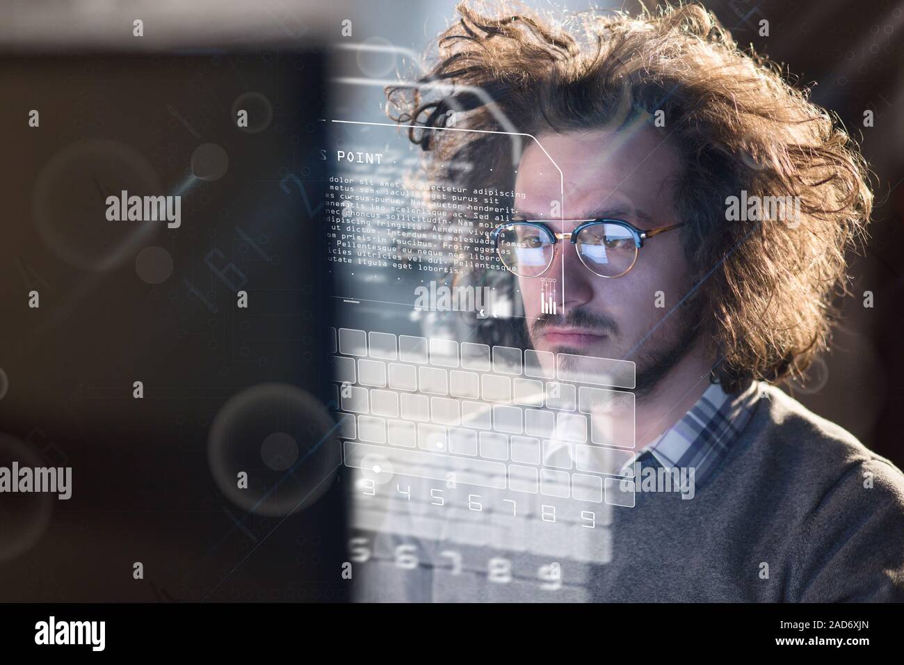 man working on computer in dark office Stock Photo - Alamy