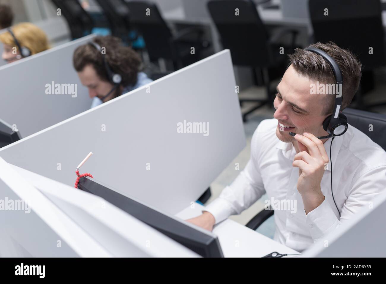 male call centre operator doing his job Stock Photo - Alamy