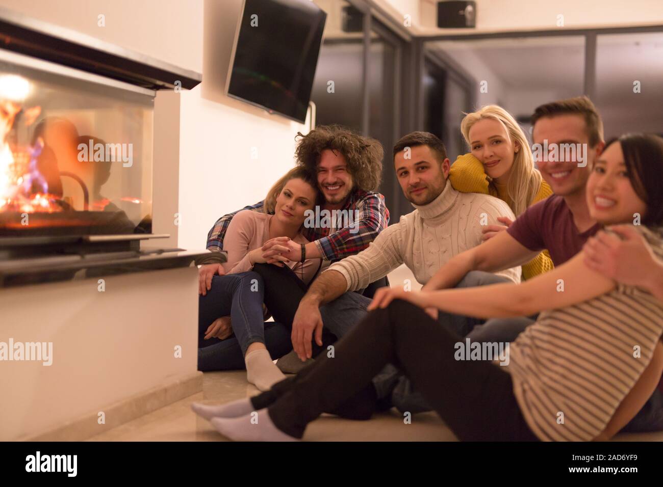 Group sitting in front fireplace hi-res stock photography and images ...