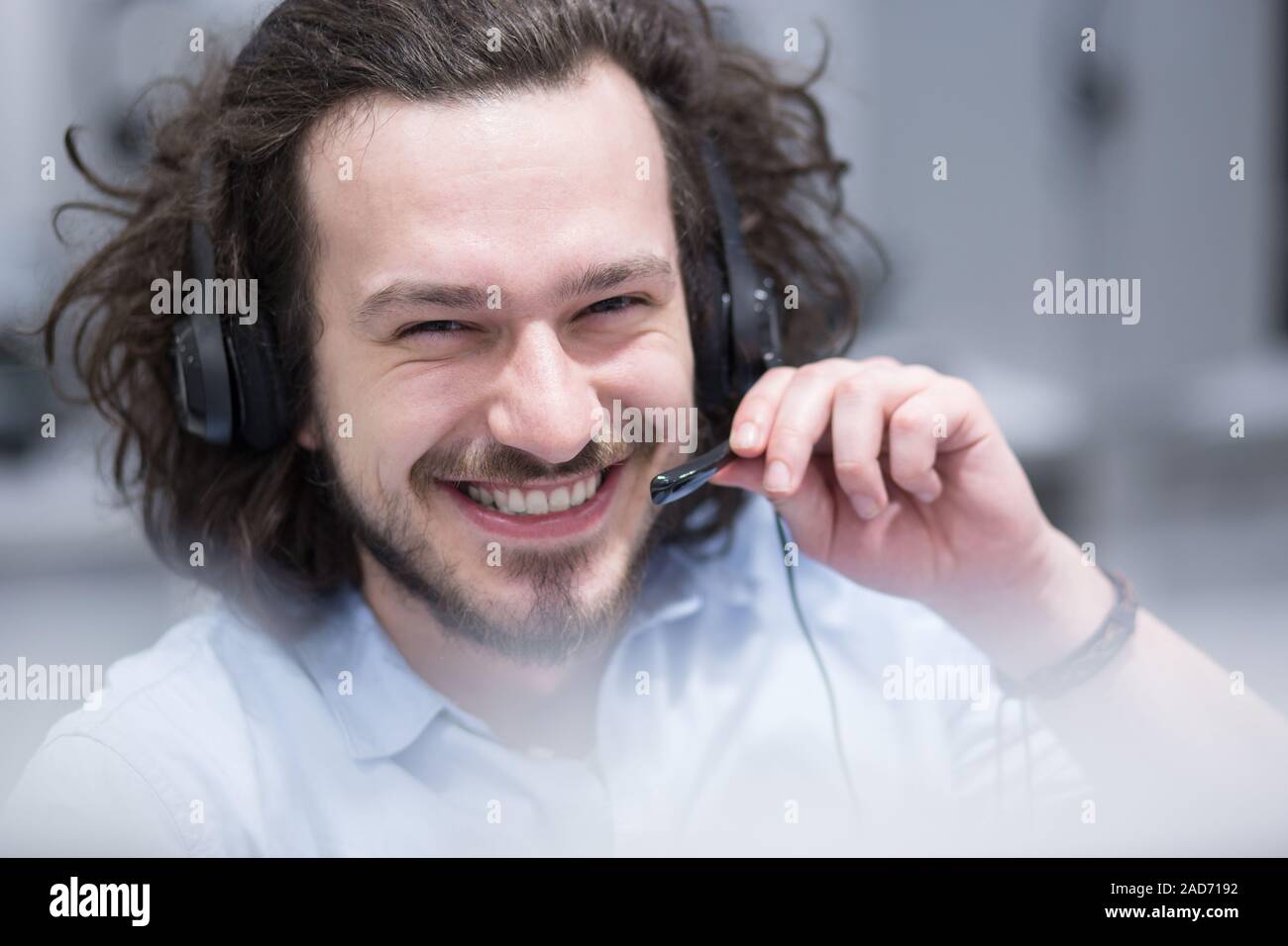 male call centre operator doing his job Stock Photo - Alamy