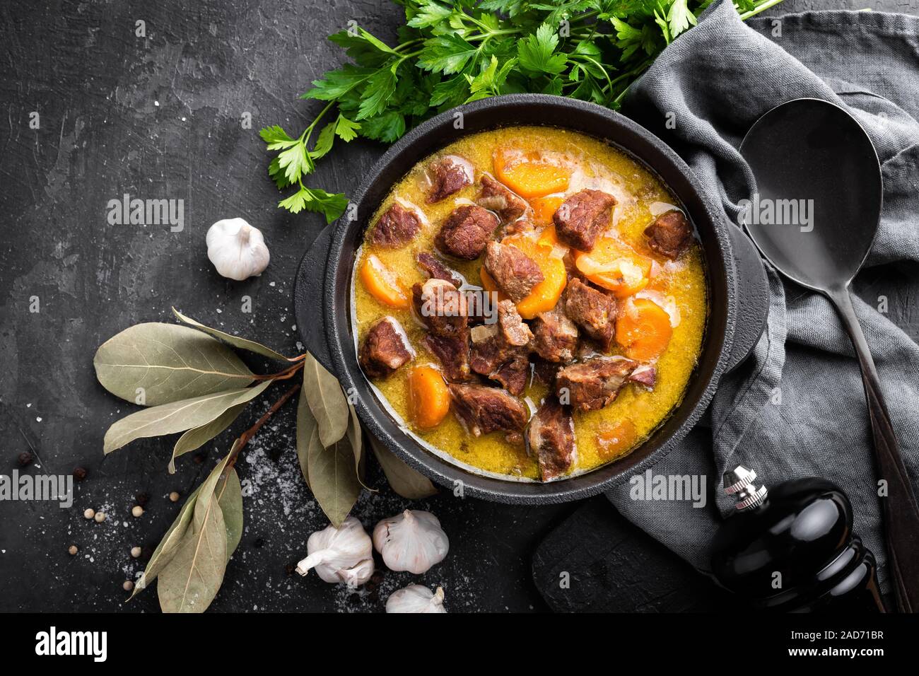 Meat stew, goulash in a cast iron pot, top view Stock Photo - Alamy