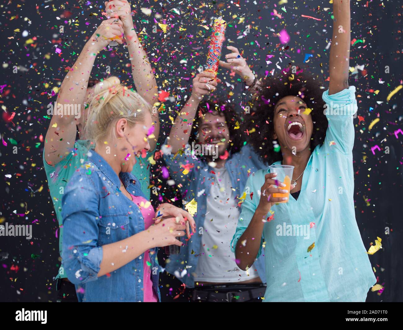 confetti party multiethnic group of people isolated over gray Stock ...