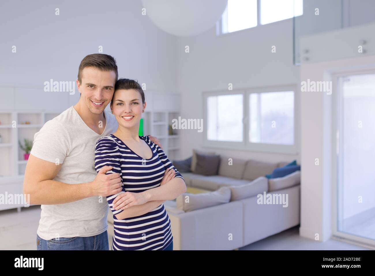 couple hugging in their new home Stock Photo - Alamy