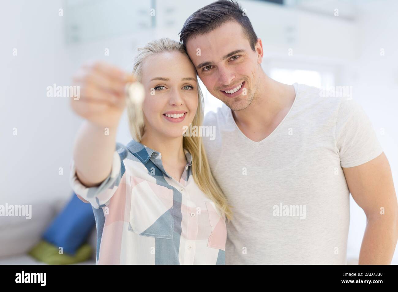 couple showing a keys of their new house Stock Photo - Alamy