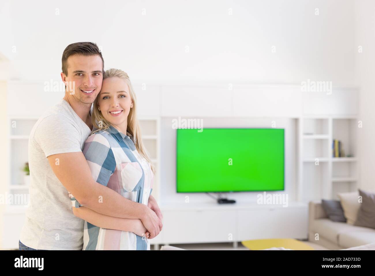 couple hugging in their new home Stock Photo - Alamy