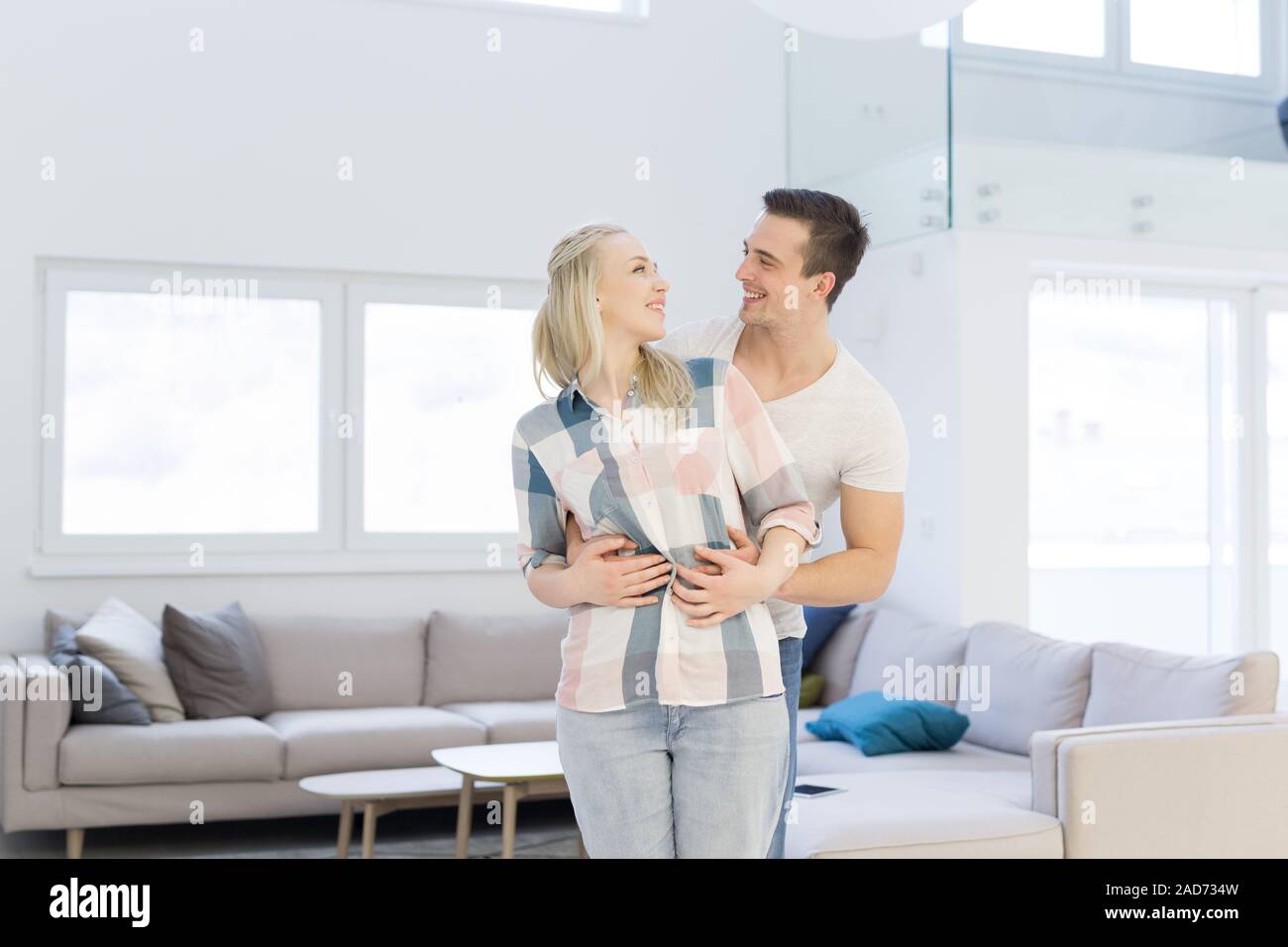 couple hugging in their new home Stock Photo - Alamy