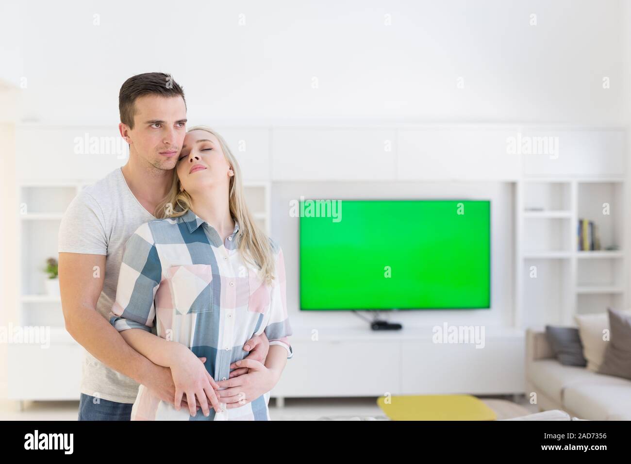 couple hugging in their new home Stock Photo - Alamy