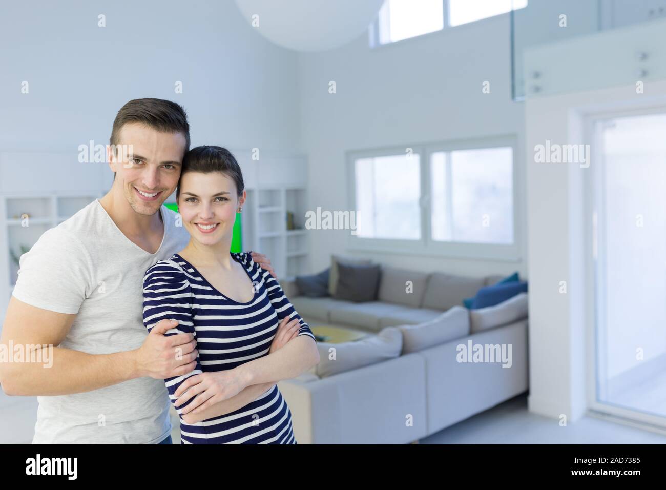 couple hugging in their new home Stock Photo - Alamy