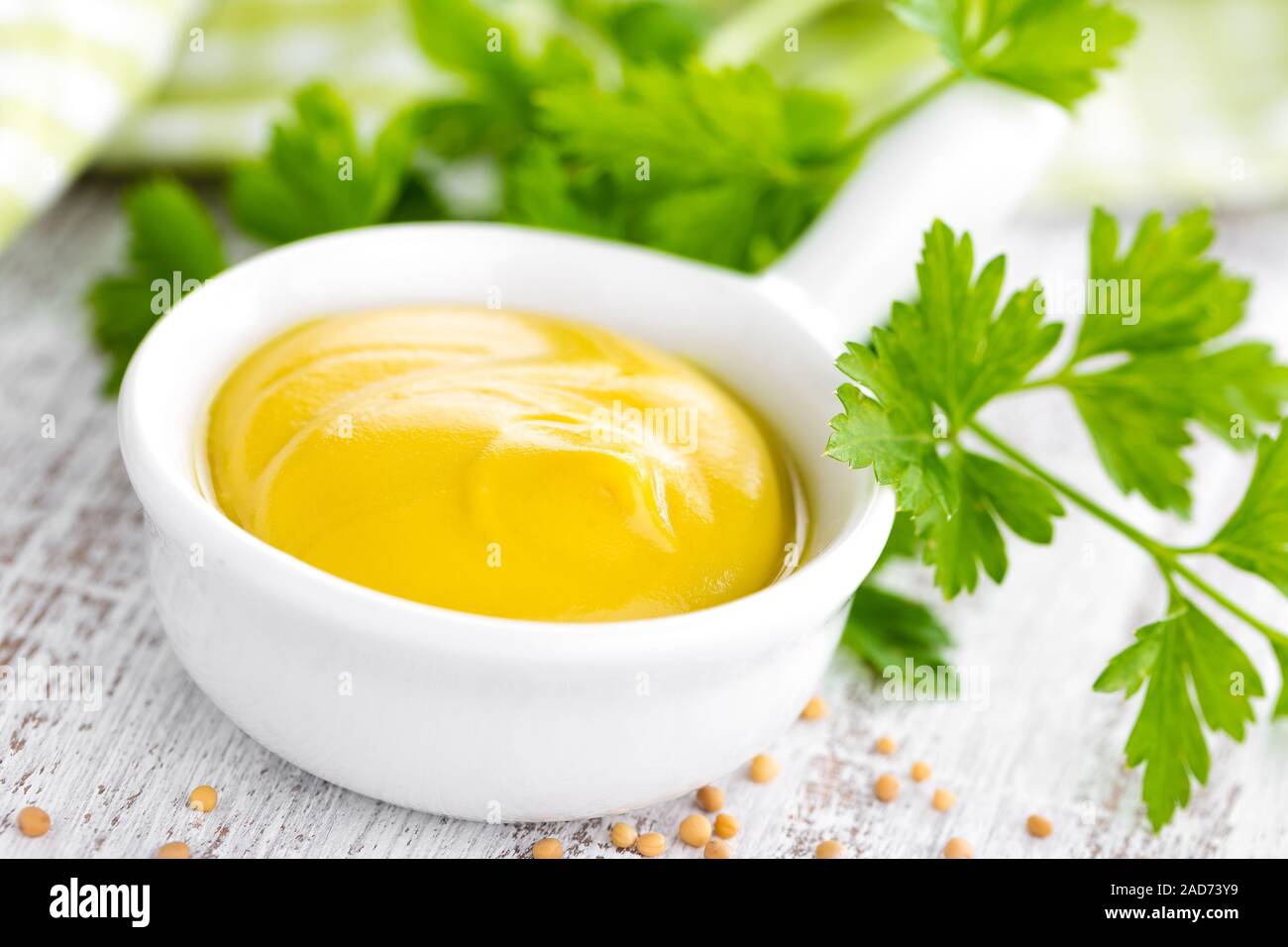 Mustard on white background Stock Photo - Alamy
