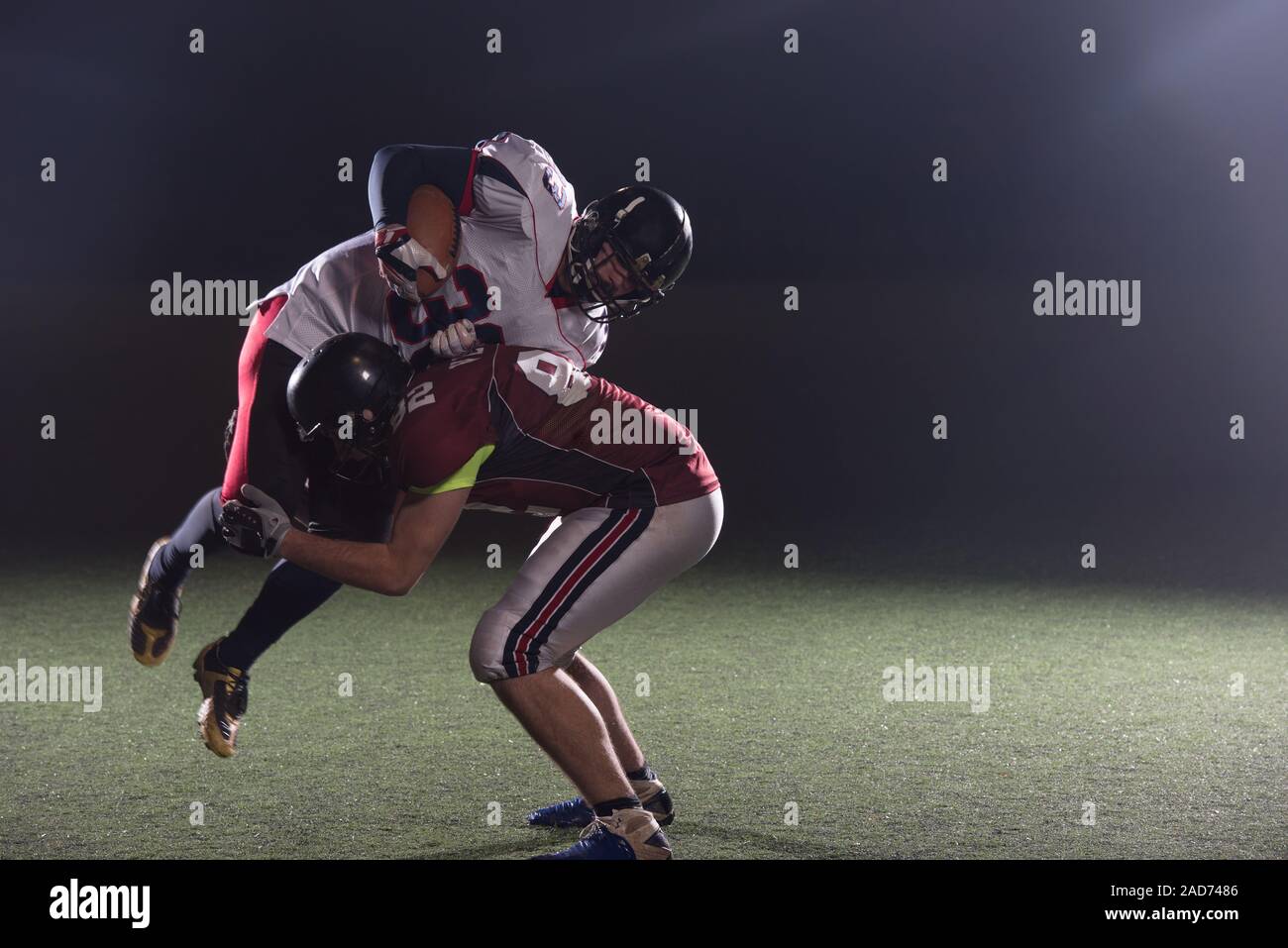 American football players in action Stock Photo - Alamy