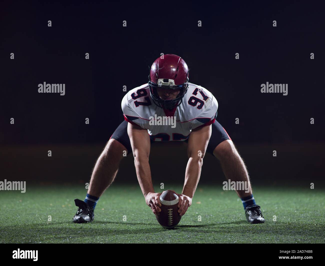 American football player starting football game Stock Photo - Alamy