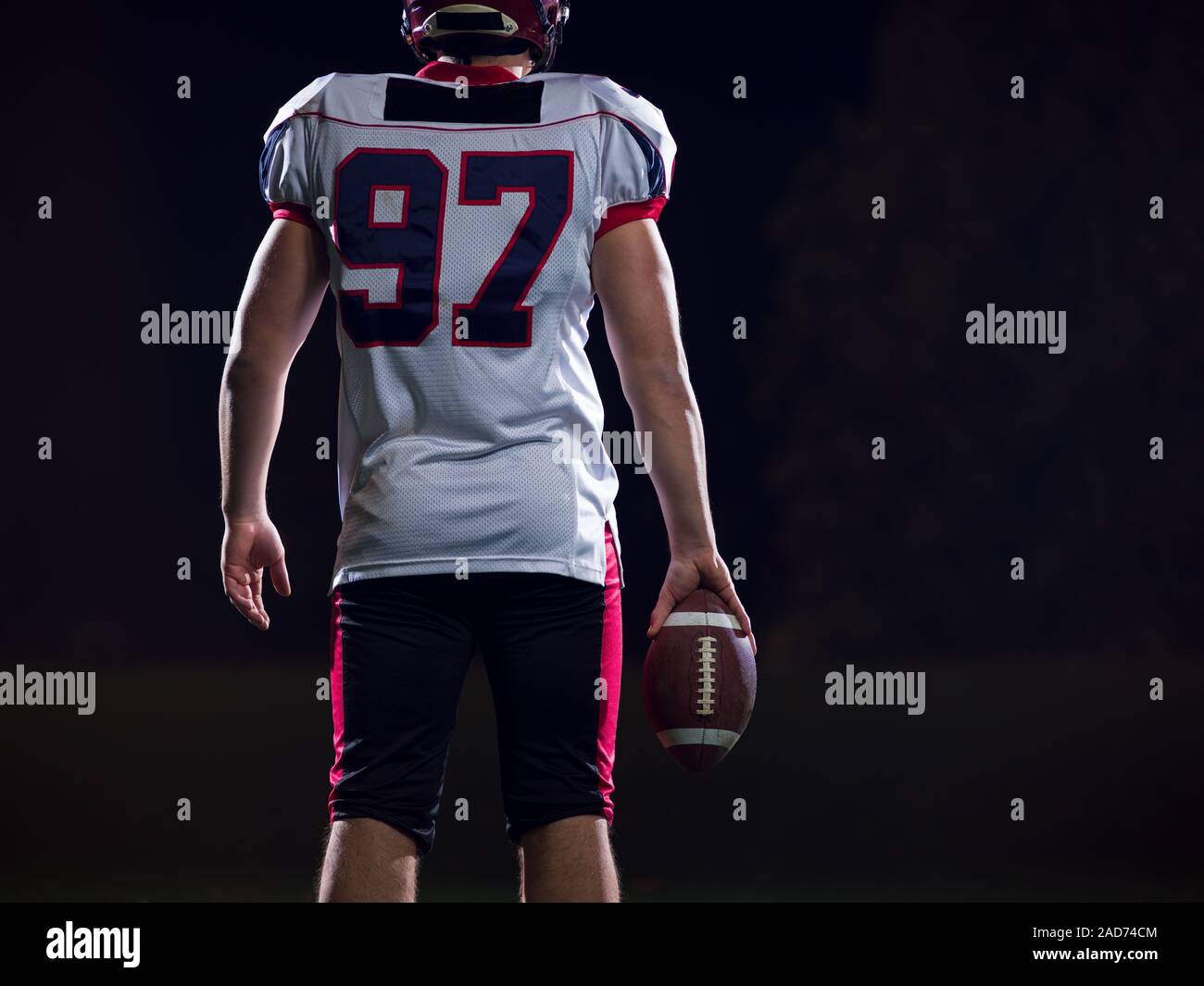 rear view of young confident American football player Stock Photo - Alamy