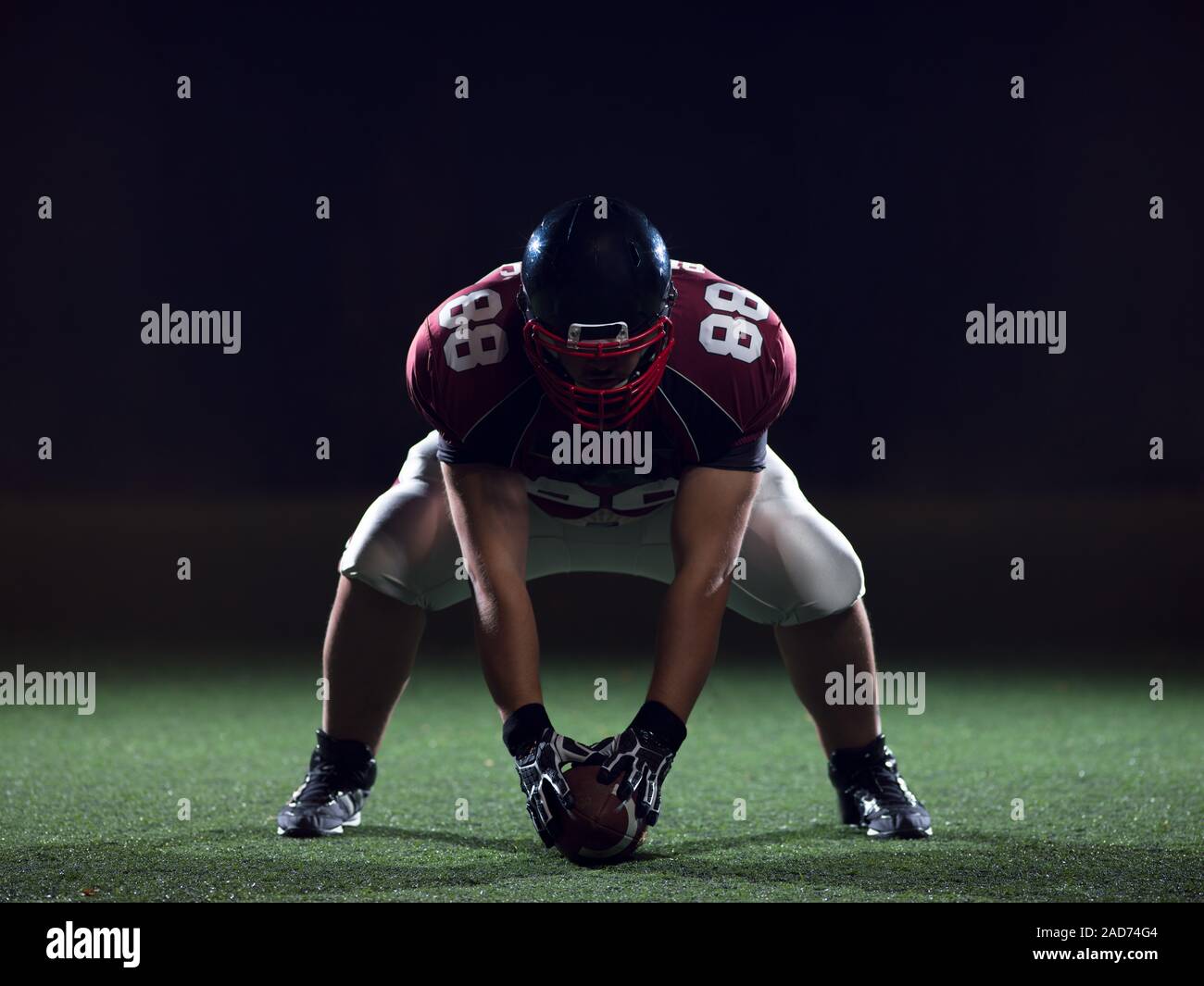 American football player starting football game Stock Photo - Alamy