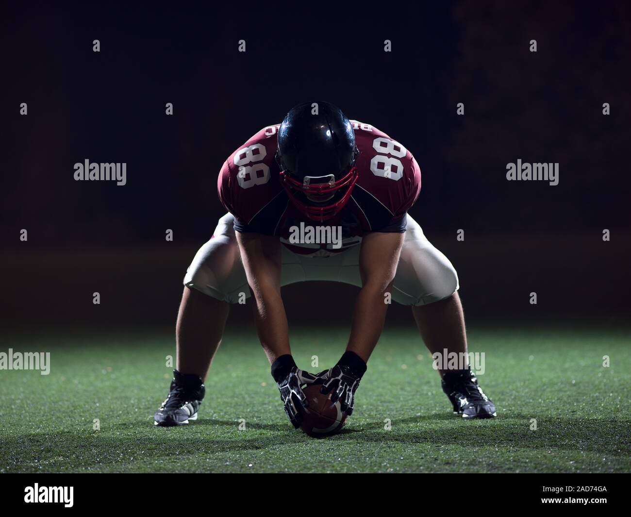 American football player starting football game Stock Photo - Alamy