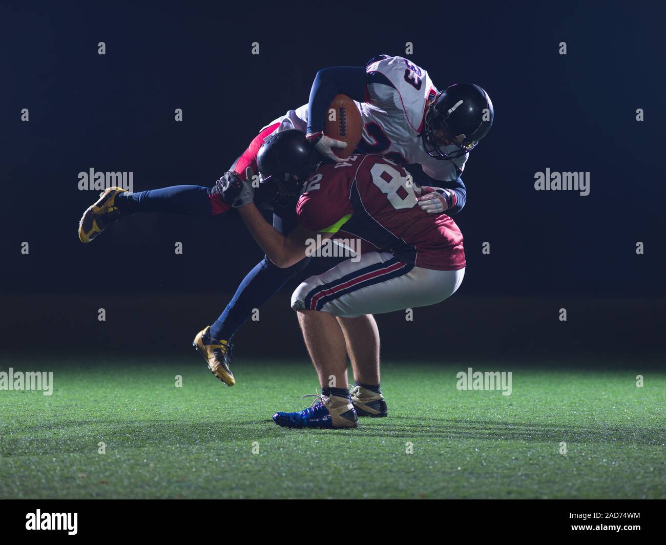 American football players in action Stock Photo - Alamy