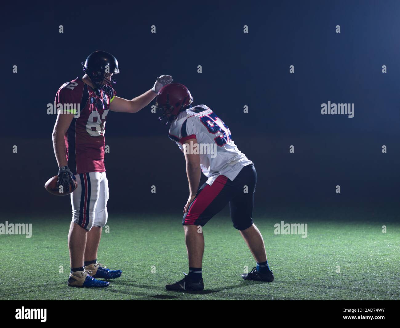 American football players in action Stock Photo - Alamy
