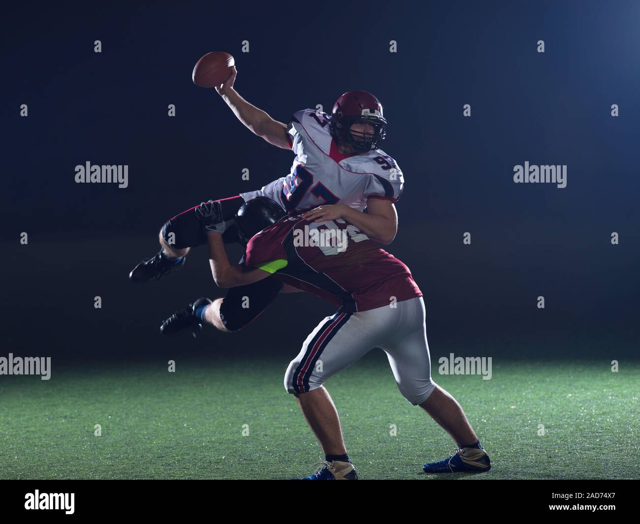 American football players in action Stock Photo - Alamy