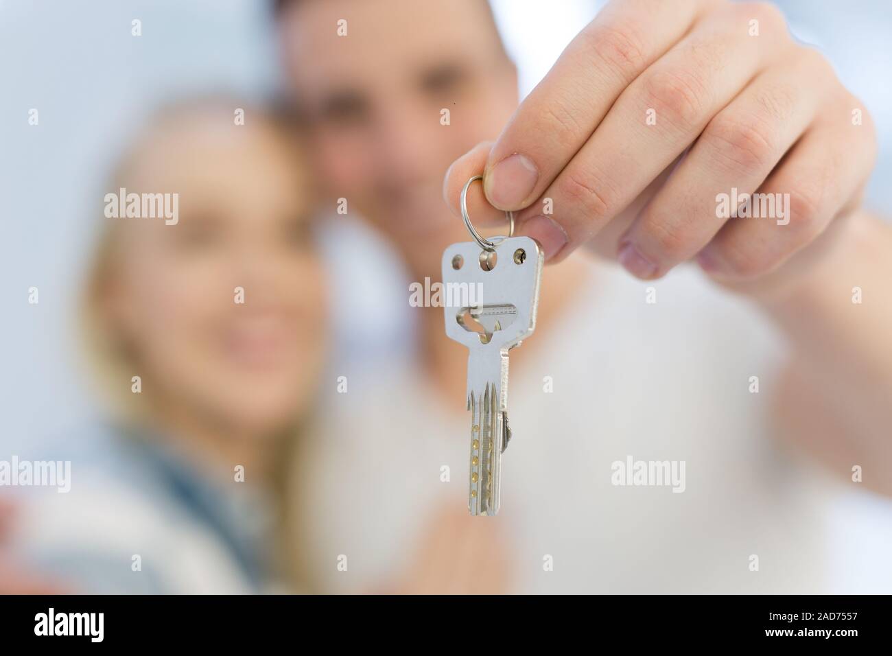 couple showing a keys of their new house Stock Photo - Alamy