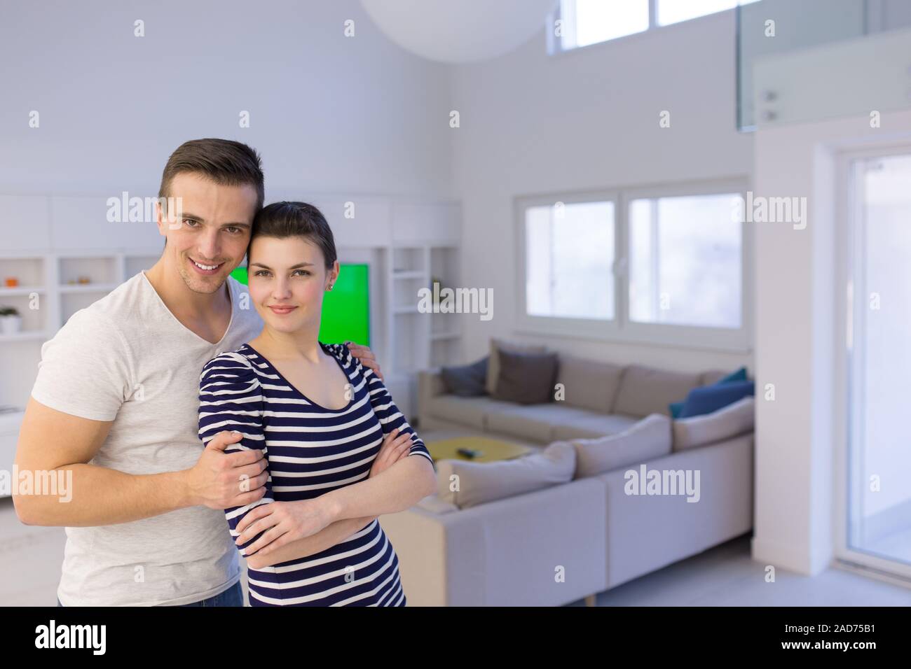 couple hugging in their new home Stock Photo - Alamy