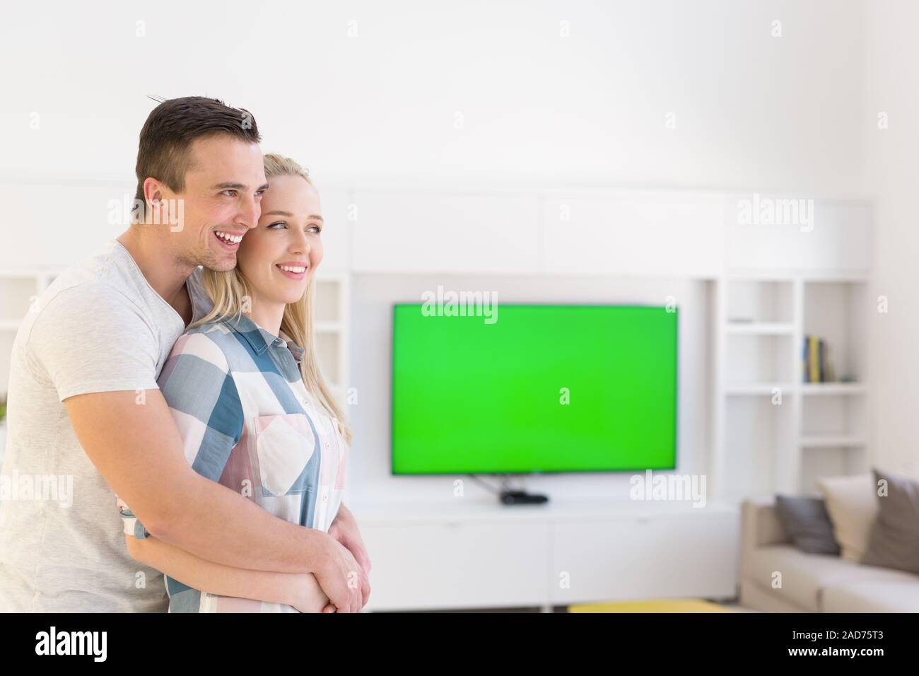 couple hugging in their new home Stock Photo - Alamy
