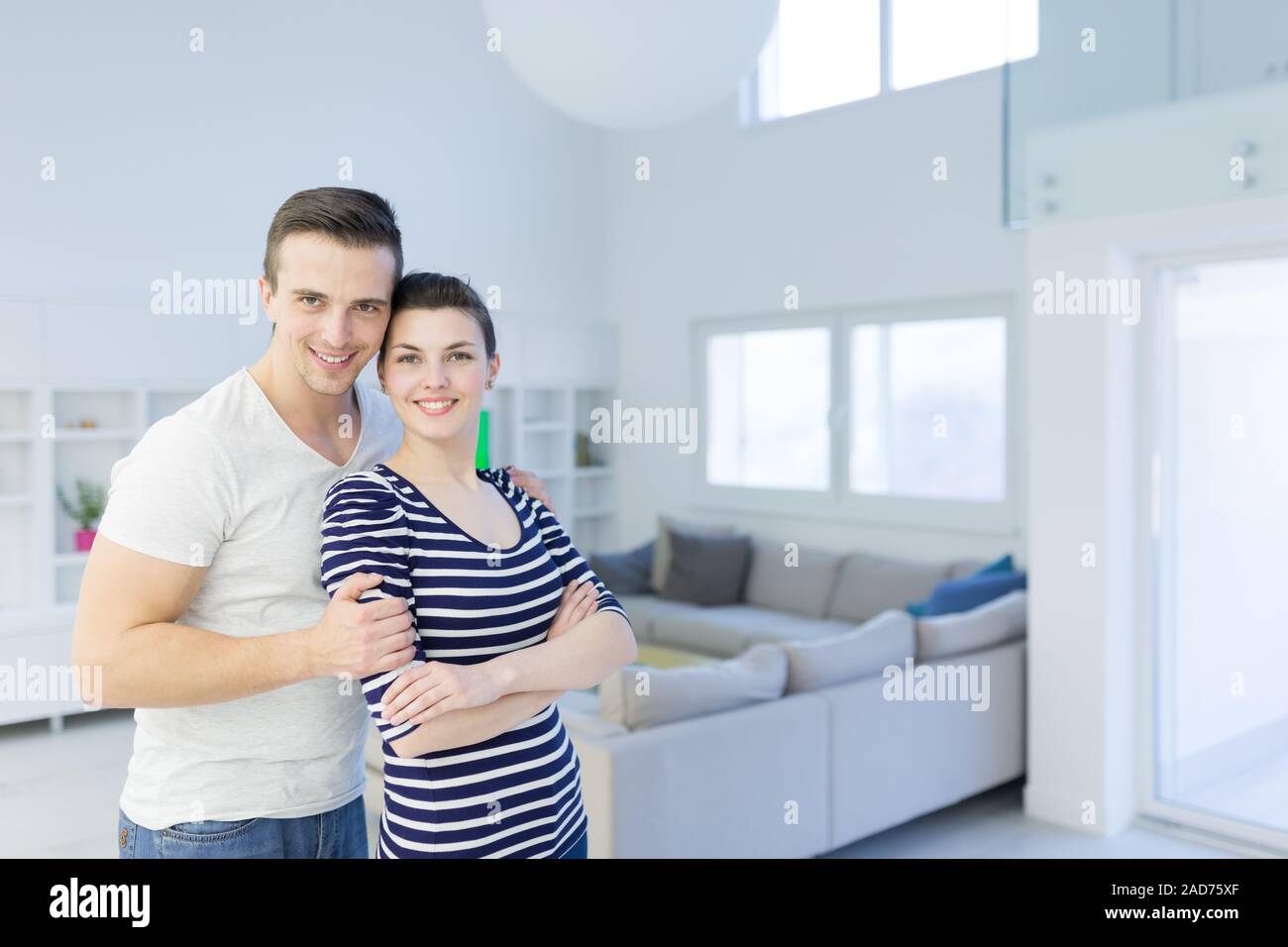 Newly married couple hug together hi-res stock photography and images ...