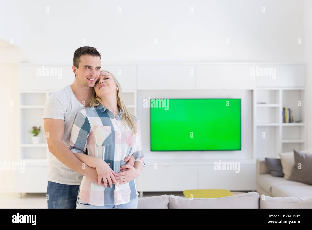 couple hugging in their new home Stock Photo - Alamy