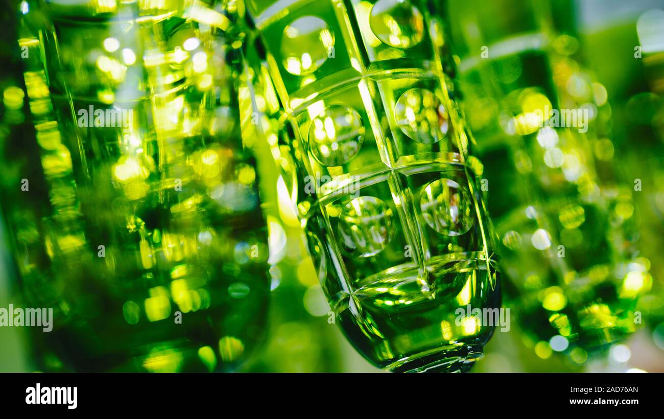 Green glasses in a row - texture with light behind Stock Photo - Alamy
